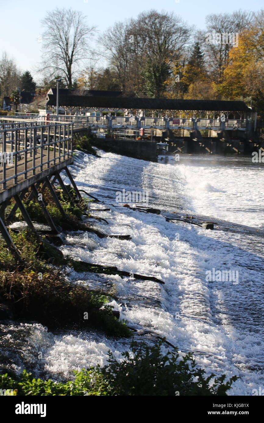 Water flowing over Sunbury weir on the River Thames west of London ...