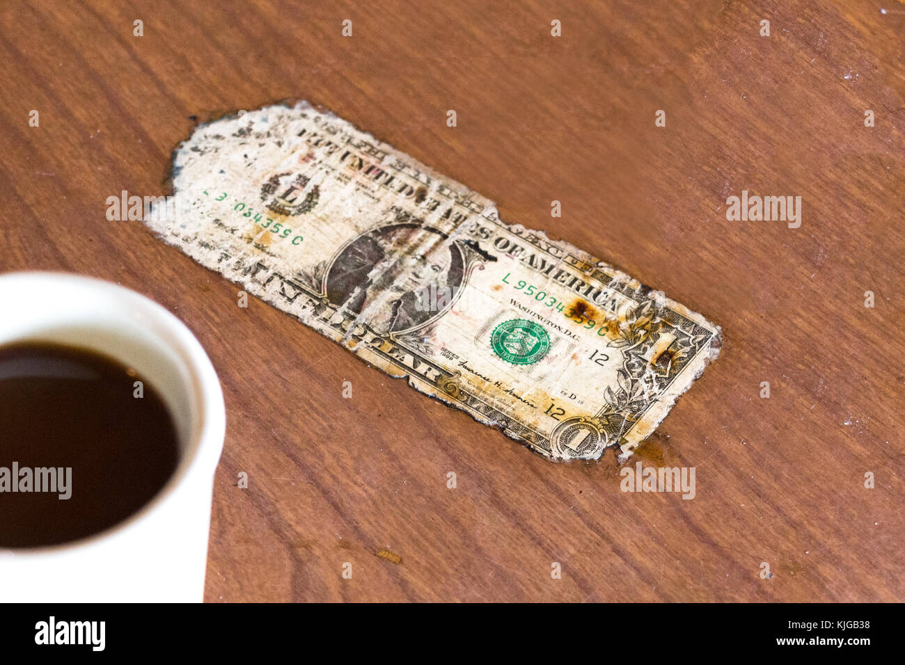 An broken and dirty one dollar banknote fixed on a table Stock Photo ...