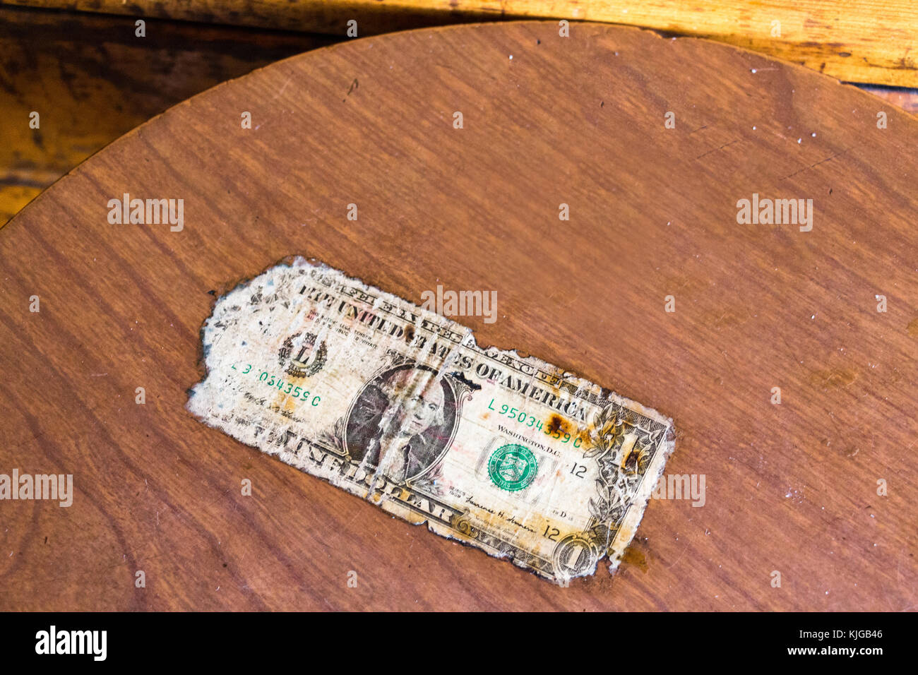 An broken and dirty one dollar banknote fixed on a table Stock Photo ...