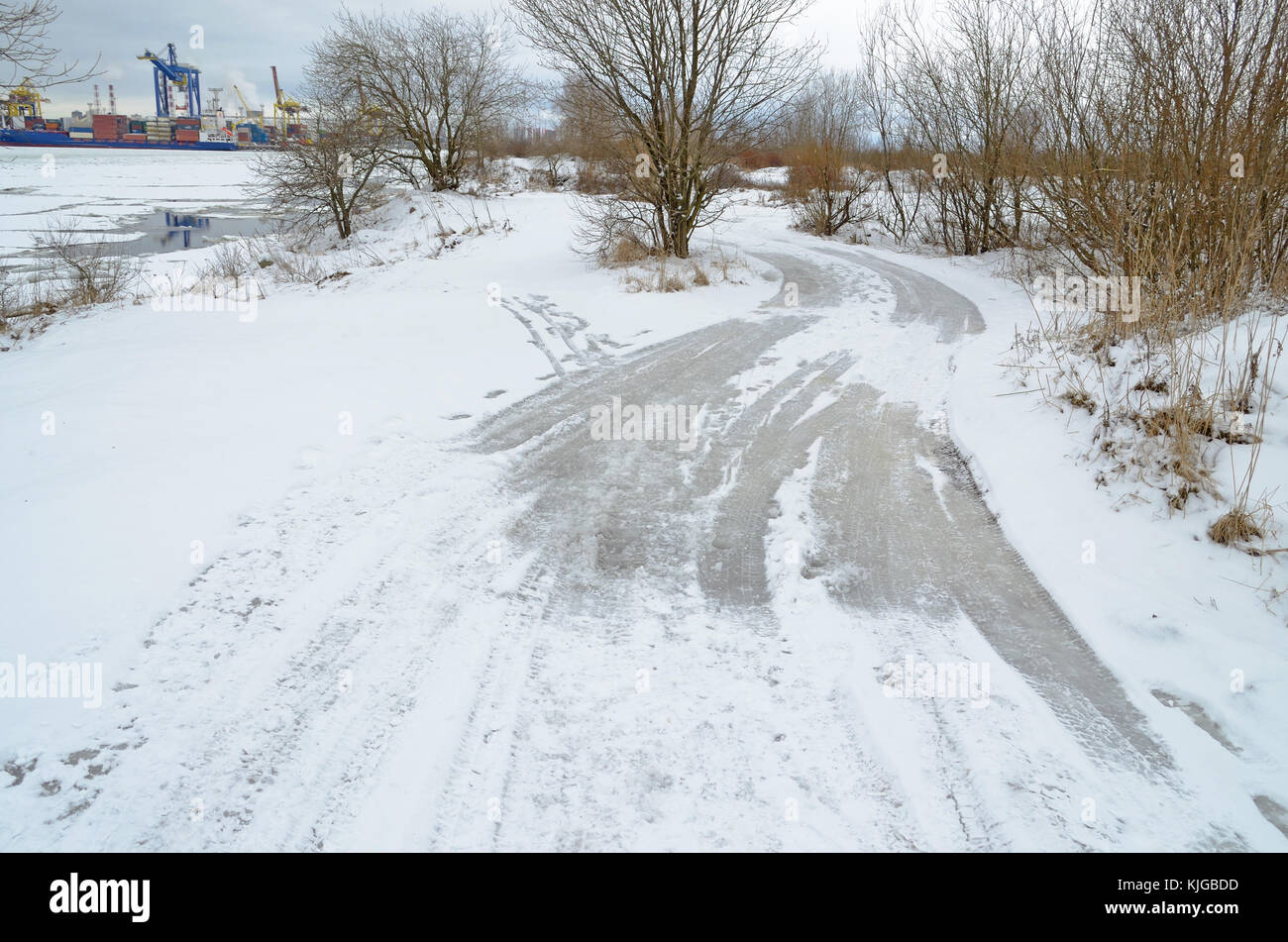 Winter snowy landscape with a road in the countryside Stock Photo - Alamy