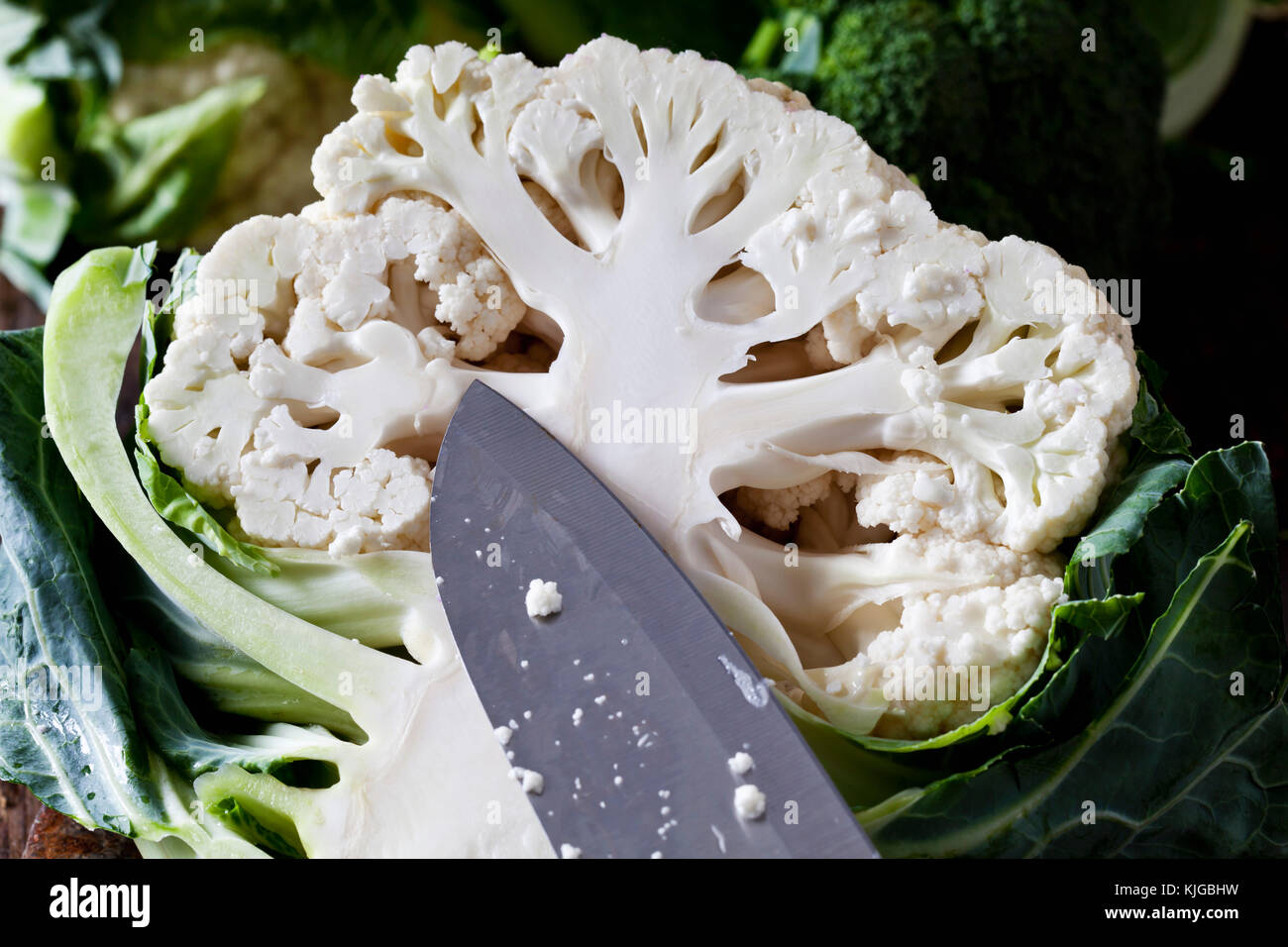 Half cauliflower and knife, close-up Stock Photo - Alamy