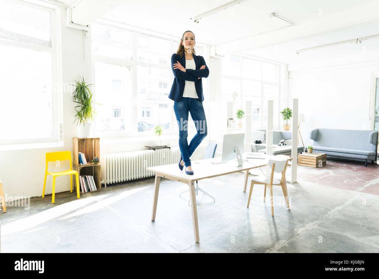 Portrait woman standing table hi-res stock photography and images - Alamy