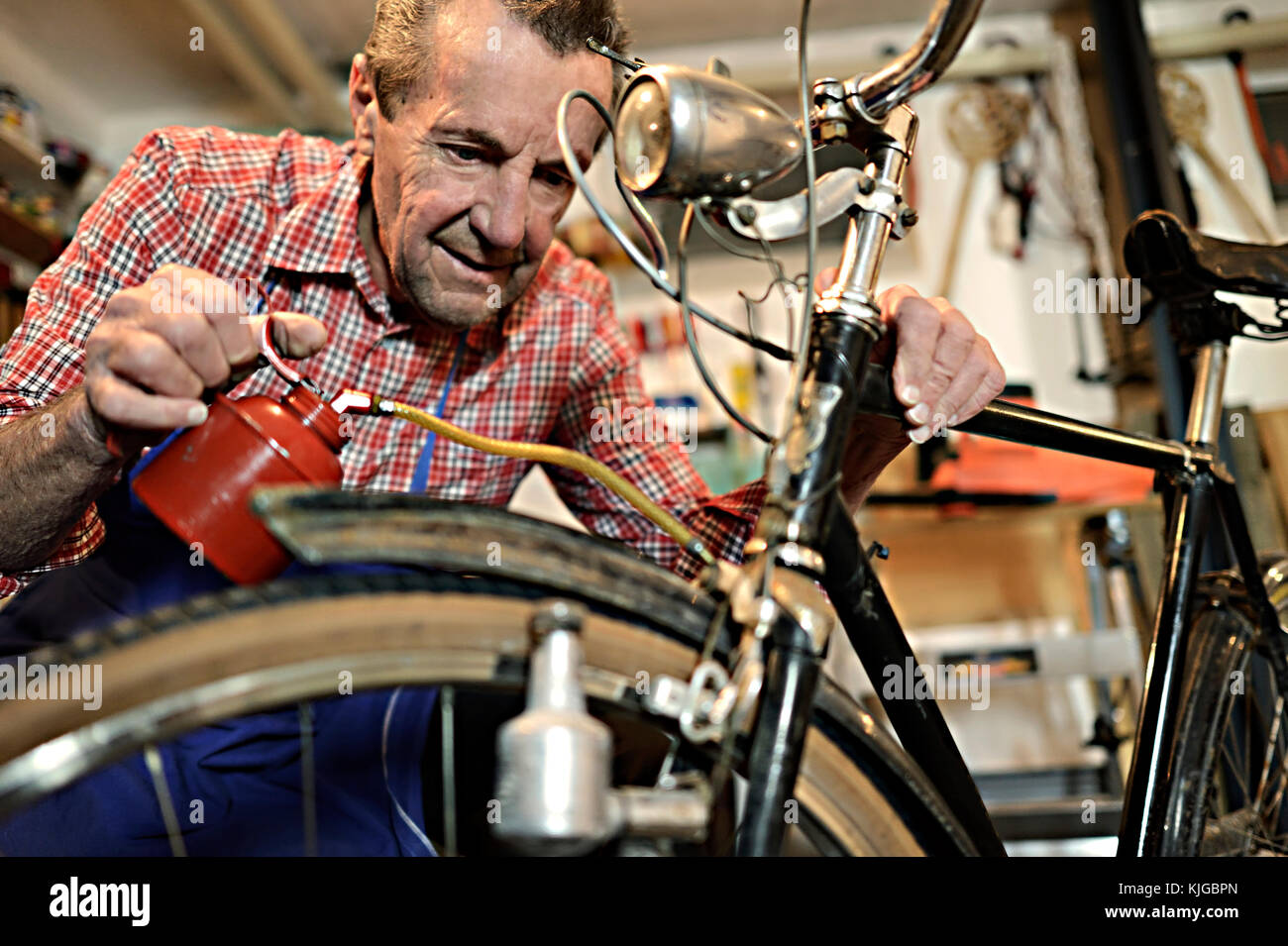 Oiling bicycle hi-res stock photography and images - Alamy