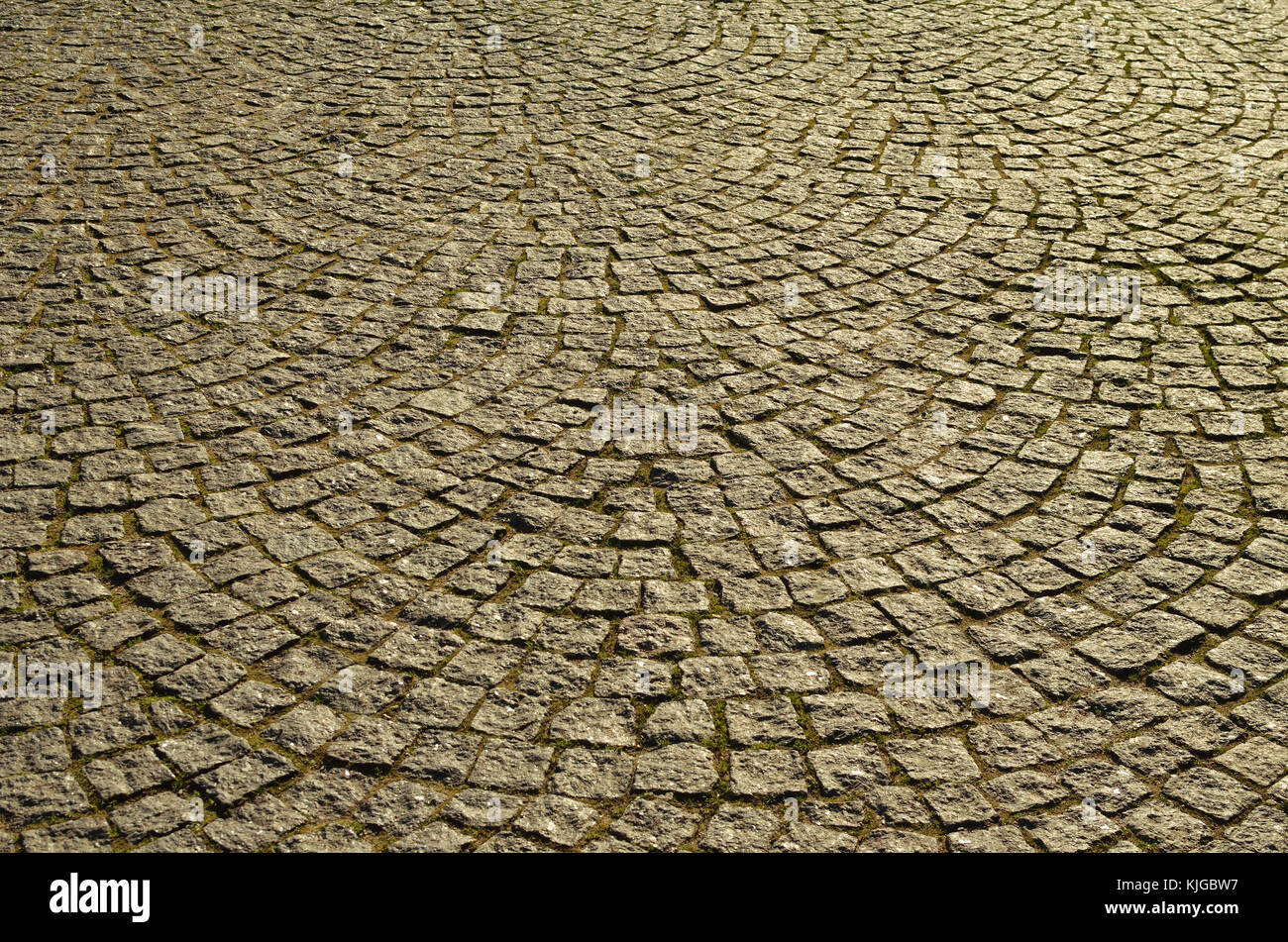 Roadway laid out from small square stones Stock Photo - Alamy