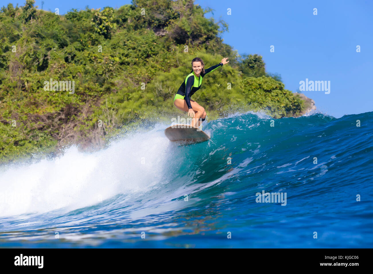 Indonesia, Bali, woman surfing Stock Photo - Alamy