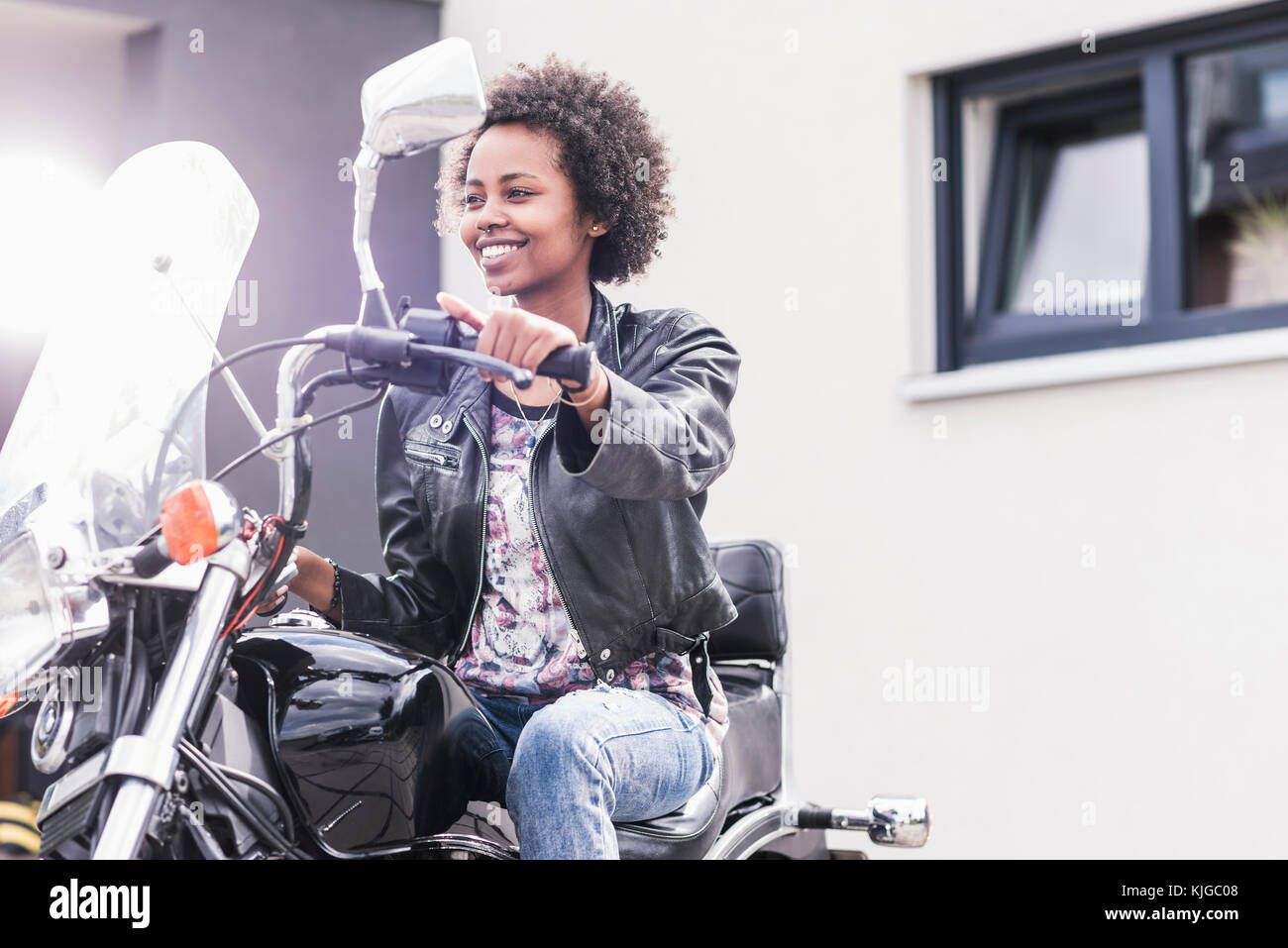 African woman on motorcycle hi-res stock photography and images - Alamy