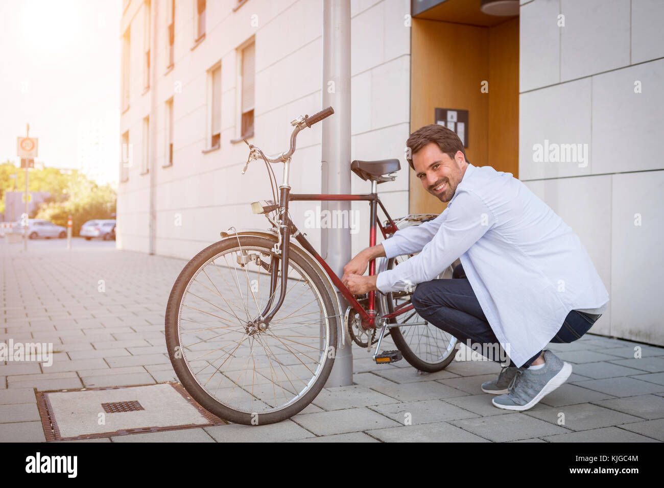 Man Locking Bicycle High Resolution Stock Photography and Images - Alamy