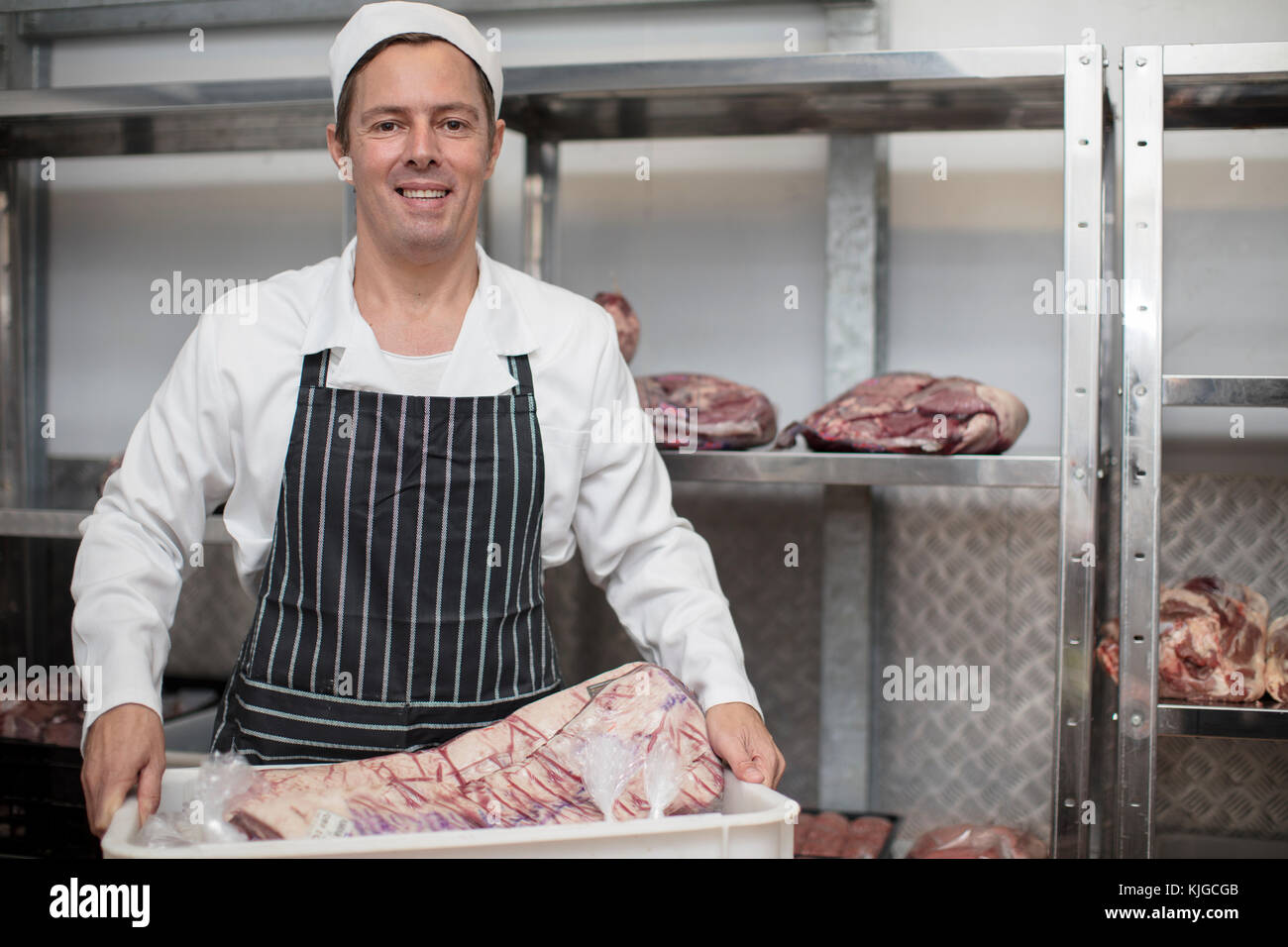 Portrait of smiling butcher Stock Photo - Alamy