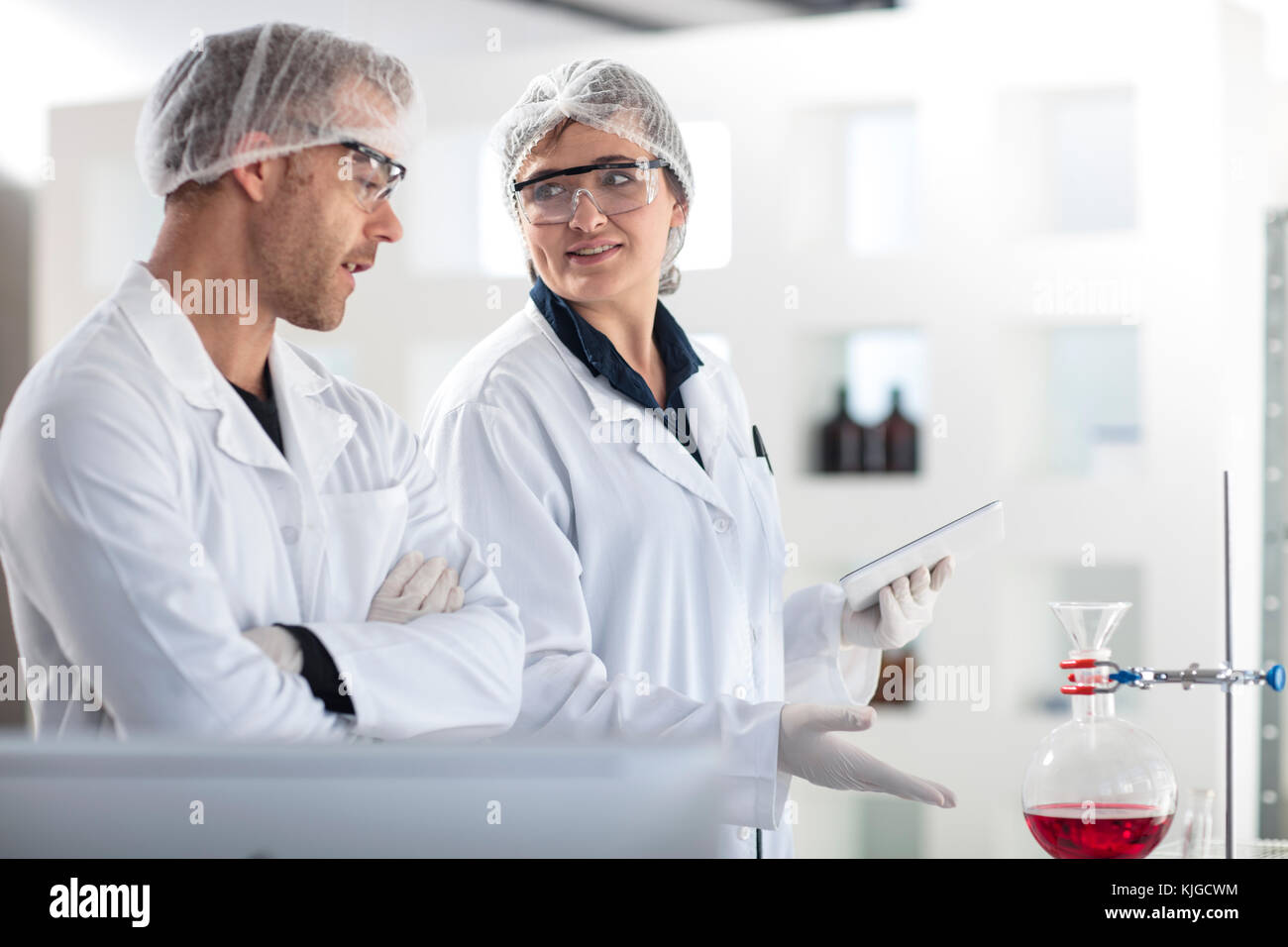 Two scientists discussing in lab Stock Photo - Alamy
