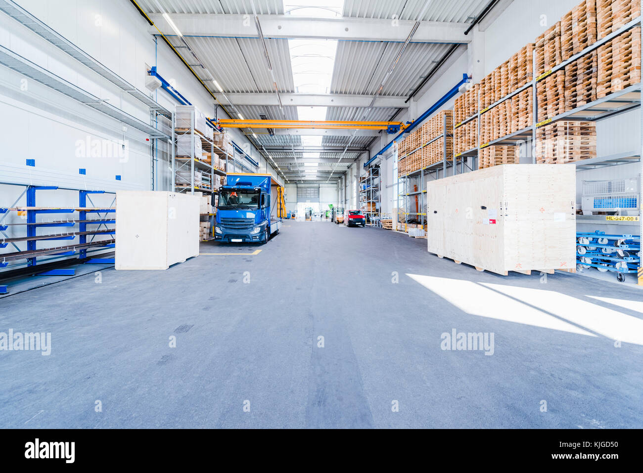 Factory hall with truck and pallets Stock Photo - Alamy