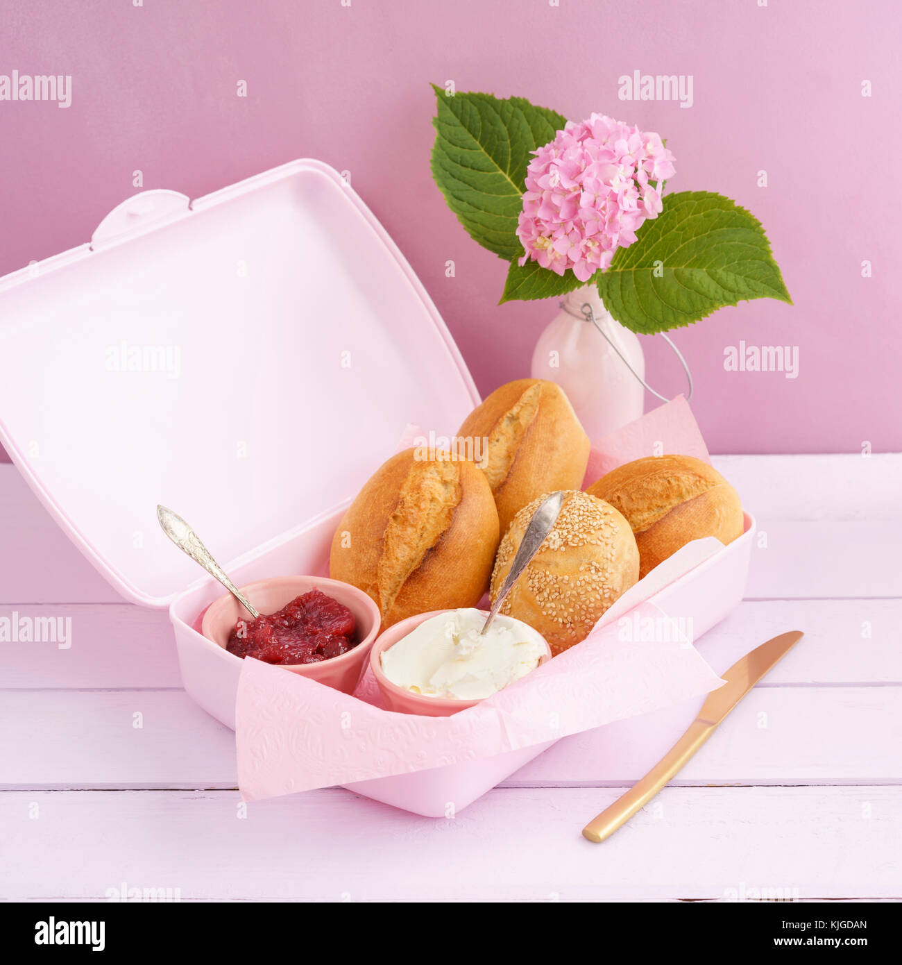 Lunch box with bread rolls, jam and cream cheese Stock Photo - Alamy