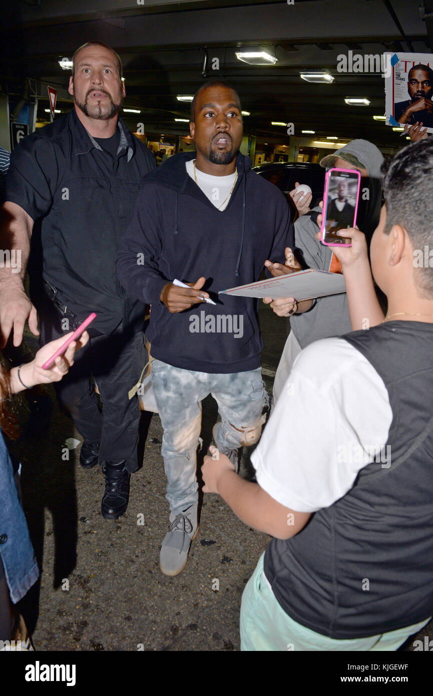 MIAMI, FL - APRIL 22: Kanye West arrives at Miami International Airport ...