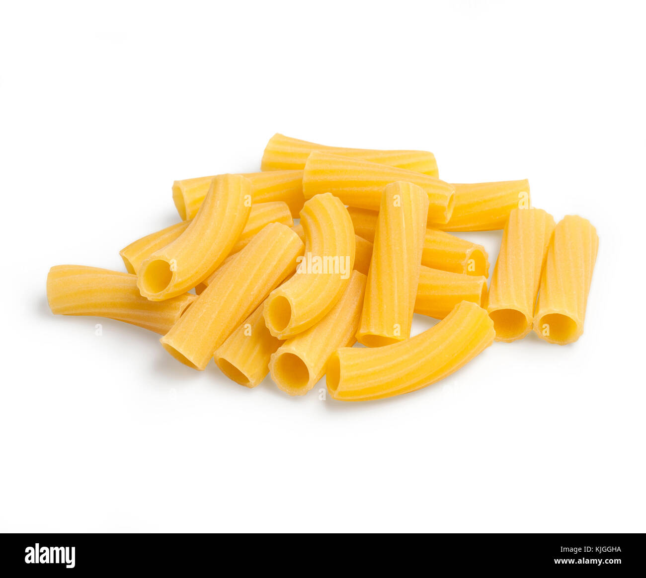 tortiglioni raw pasta isolated on white background Stock Photo - Alamy