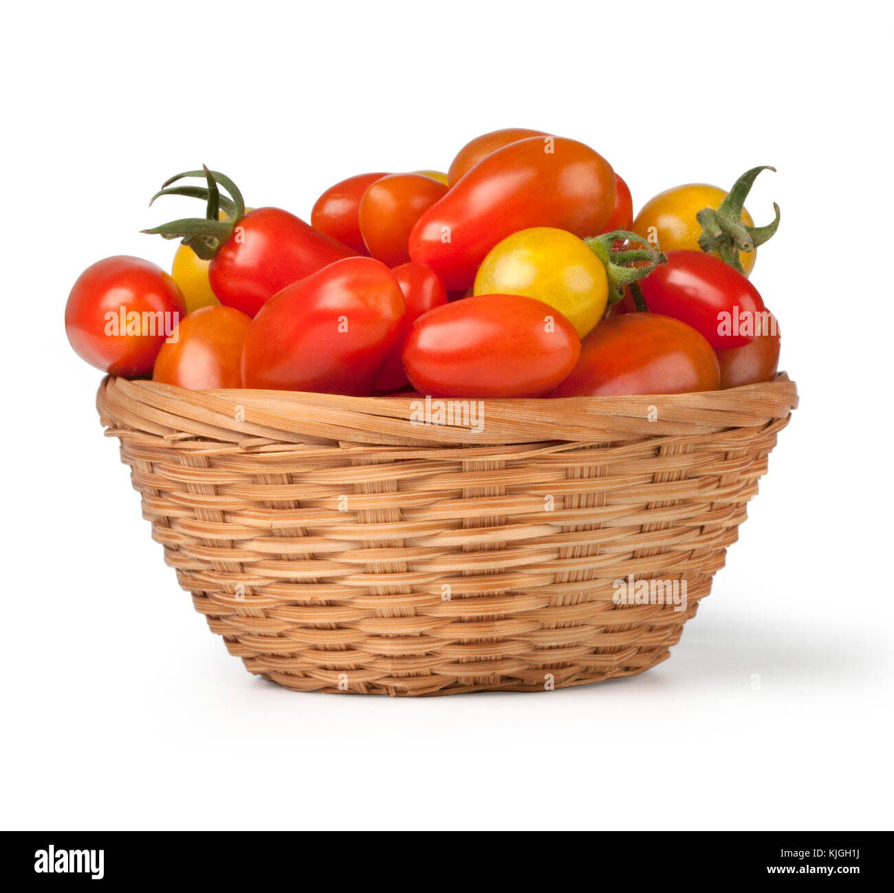 Fresh red tomatoes in a basket on a white background. with clipping ...