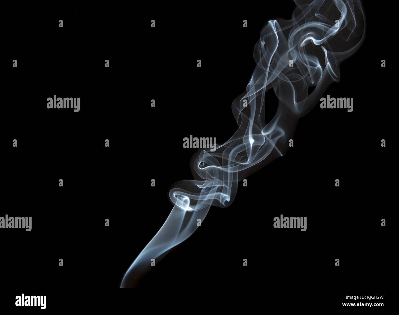 Smoke volutes on a pure black background Stock Photo - Alamy