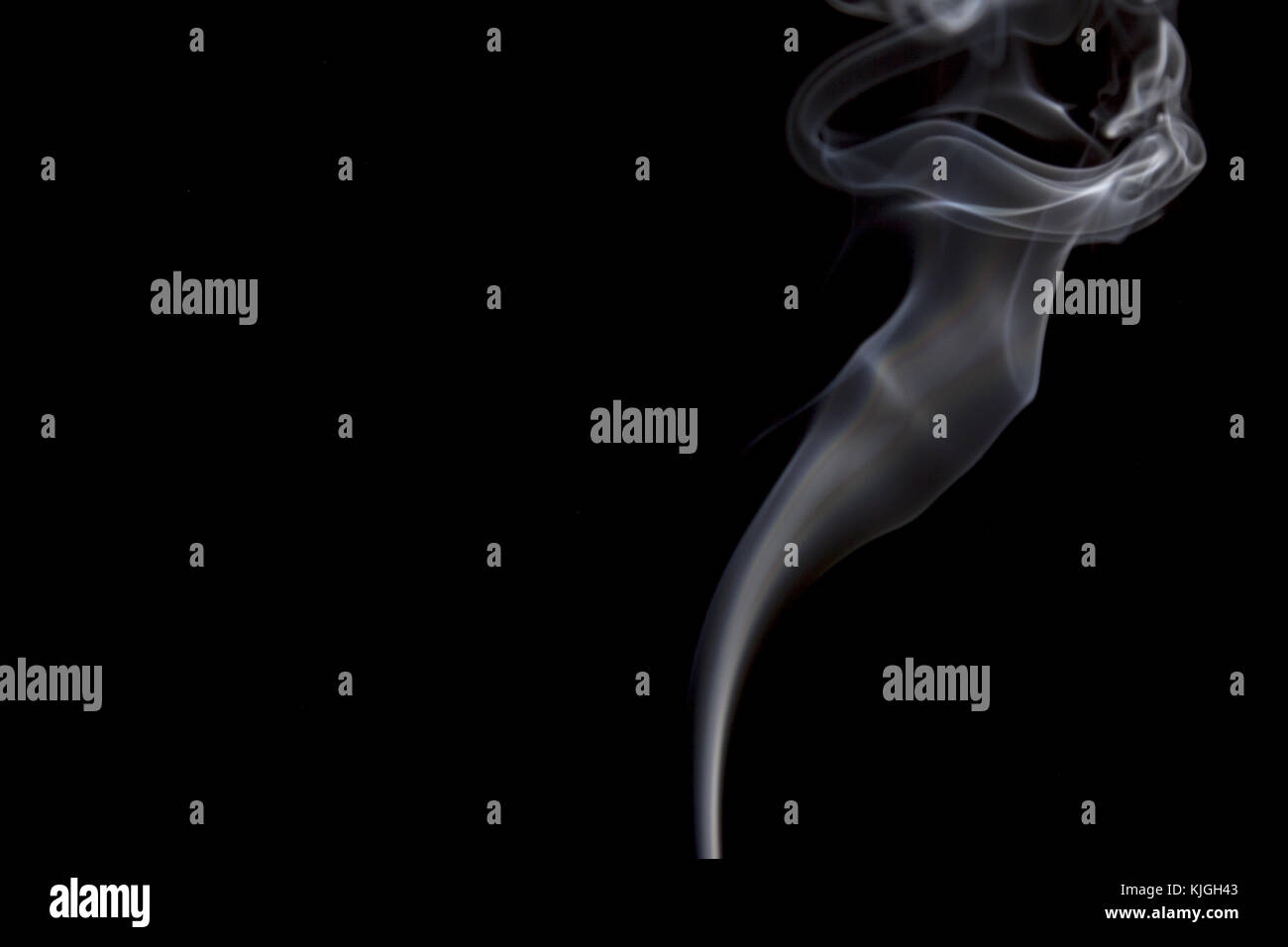 Smoke volutes on a pure black background Stock Photo - Alamy