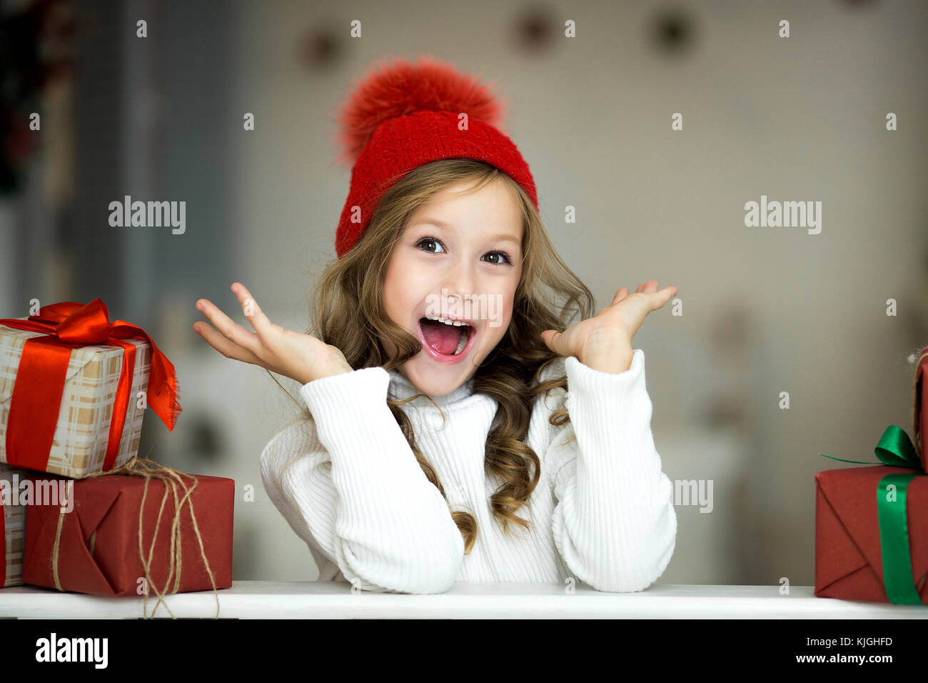 Beautiful little girl celebrates Christmas. New Year's holidays. Happy ...