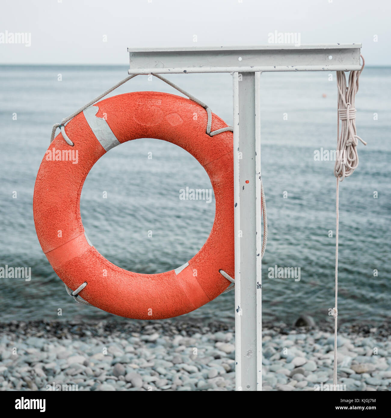 orange lifebuoy on the sea coast Stock Photo - Alamy