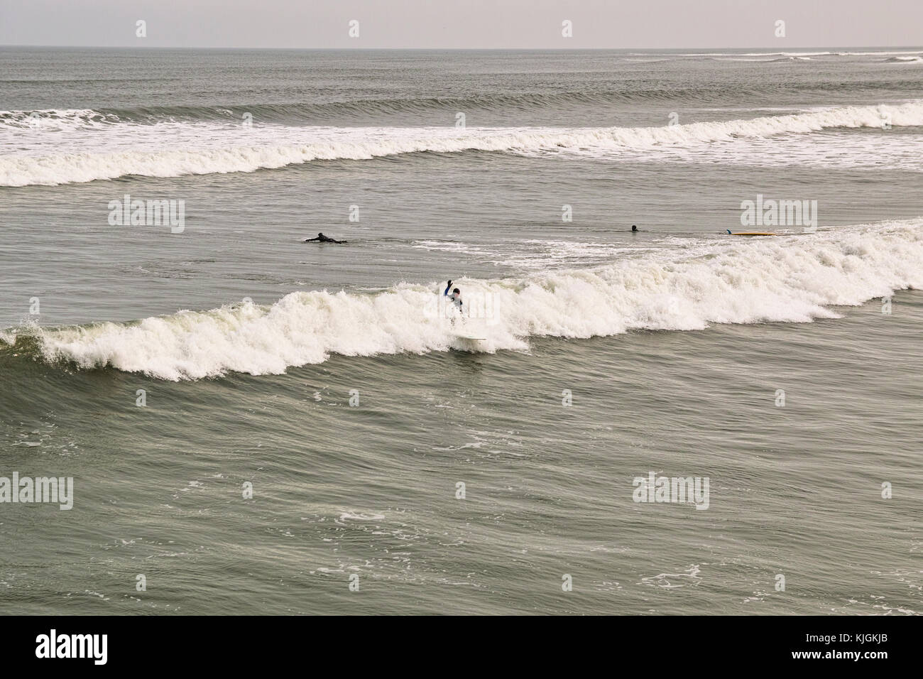 Surfers in the North sea at Saltburn by the sea in North Riding of ...
