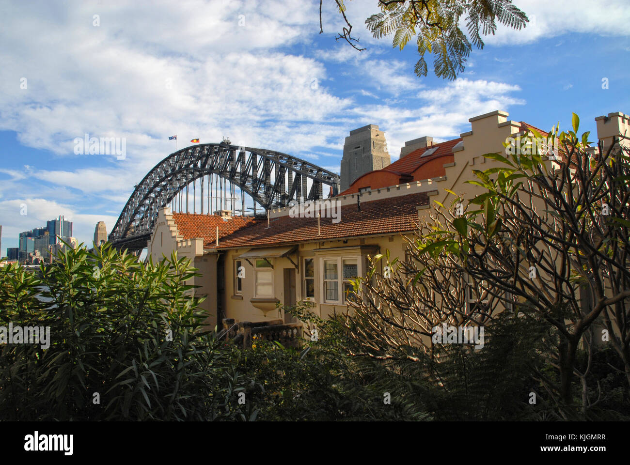View of Harbour Bridge from village with old houses and trees (Neutral ...
