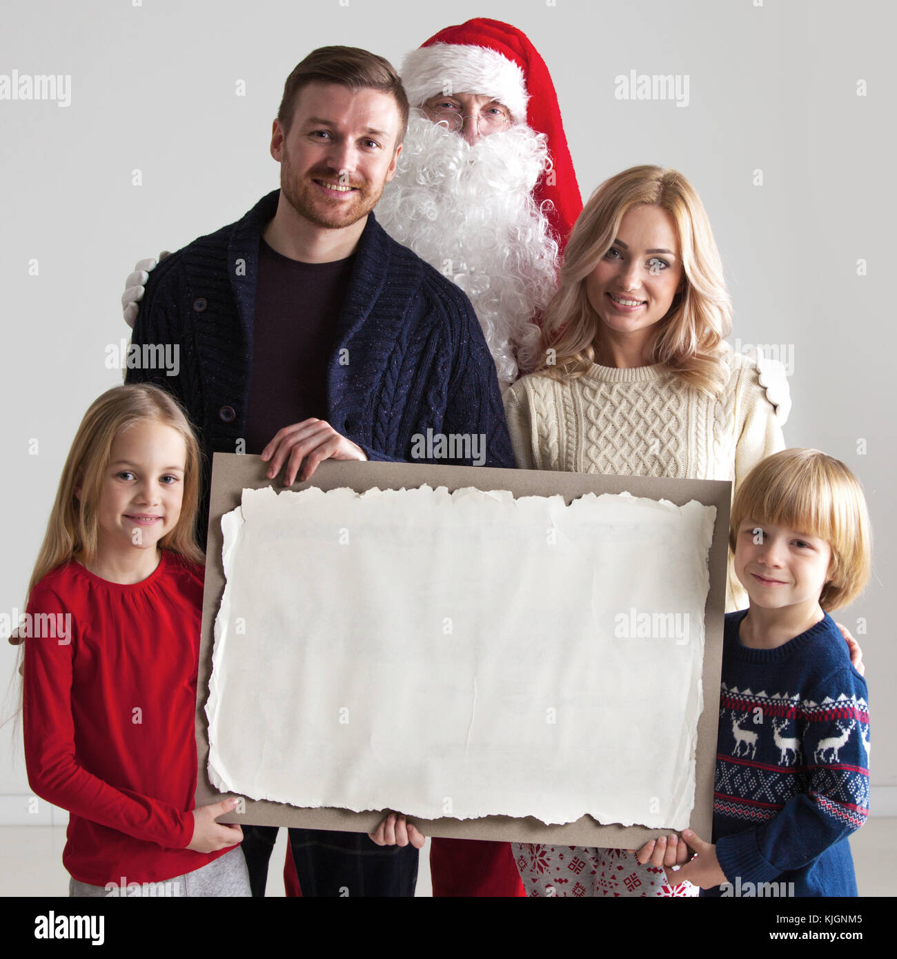 Christmas portrait of happy smiling family with two children and Santa ...