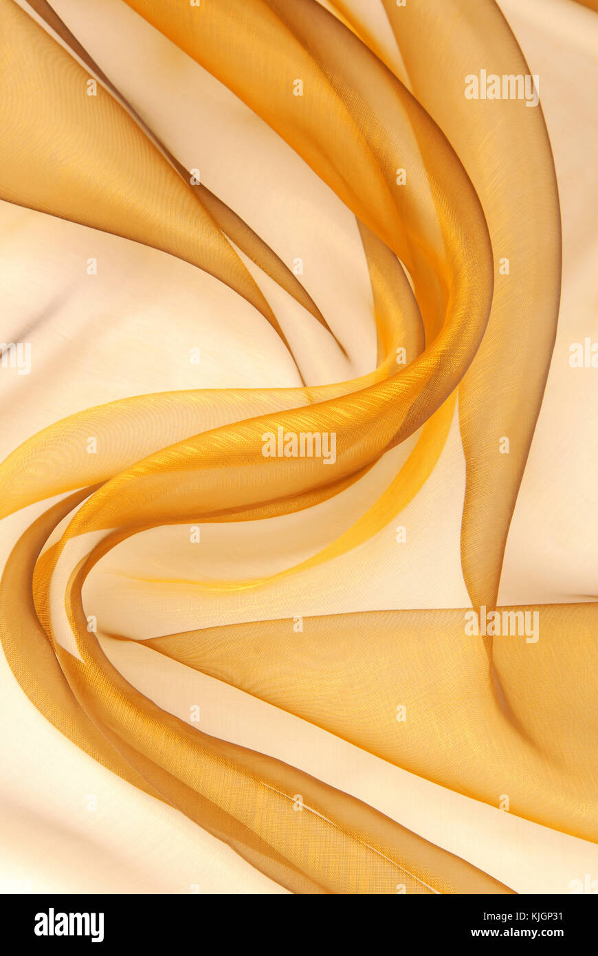 golden organza fabric wavy texture Stock Photo - Alamy