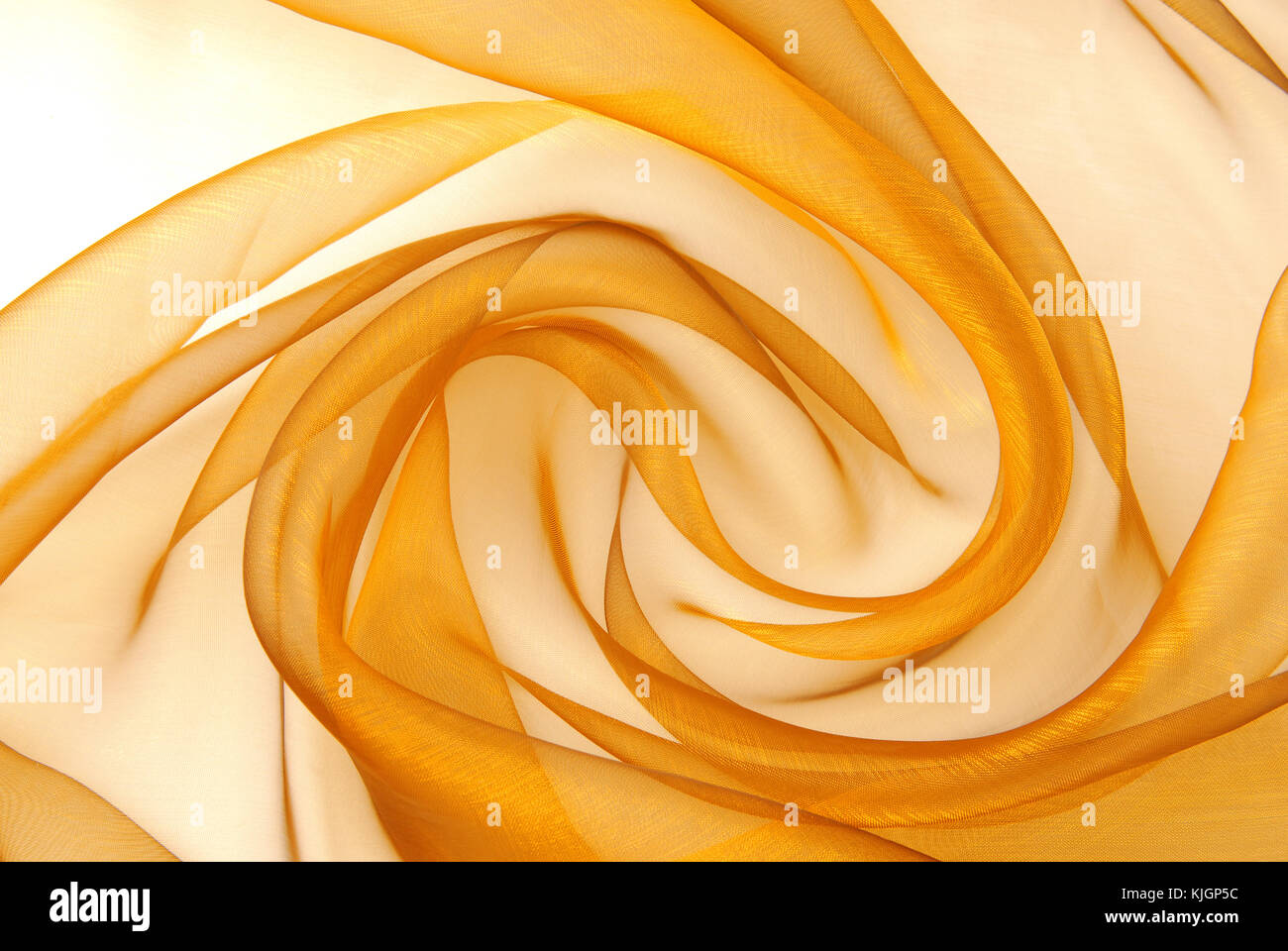 golden organza fabric wavy texture Stock Photo - Alamy