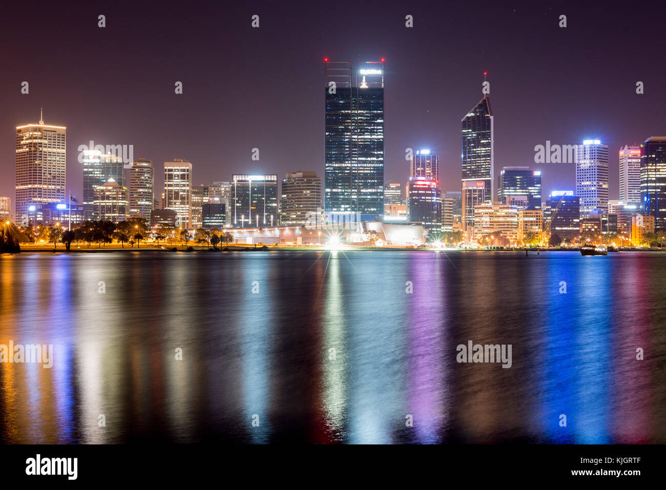 Perth, Western Australia, viewed at night reflected in the Swan River ...