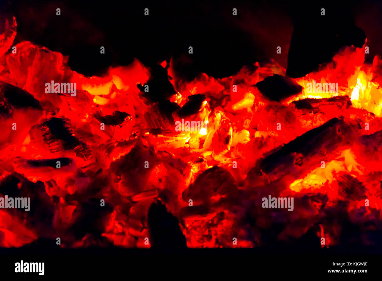 Photo of smouldering coal in dark night Stock Photo - Alamy