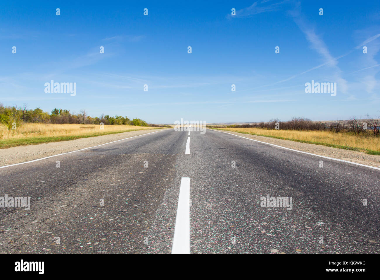 Photo of day landscape with empty road Stock Photo - Alamy