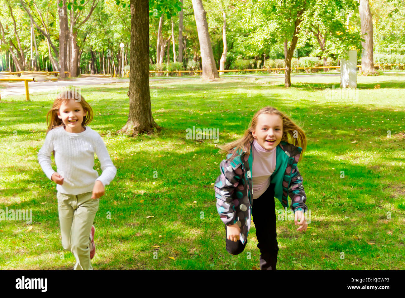 Photo of two running girls in summer Stock Photo - Alamy