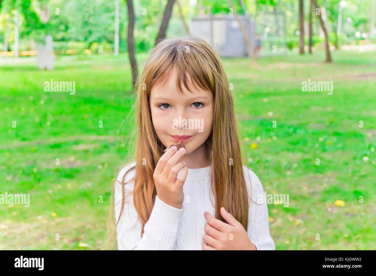 Photo of eating cute girl with long hair Stock Photo - Alamy