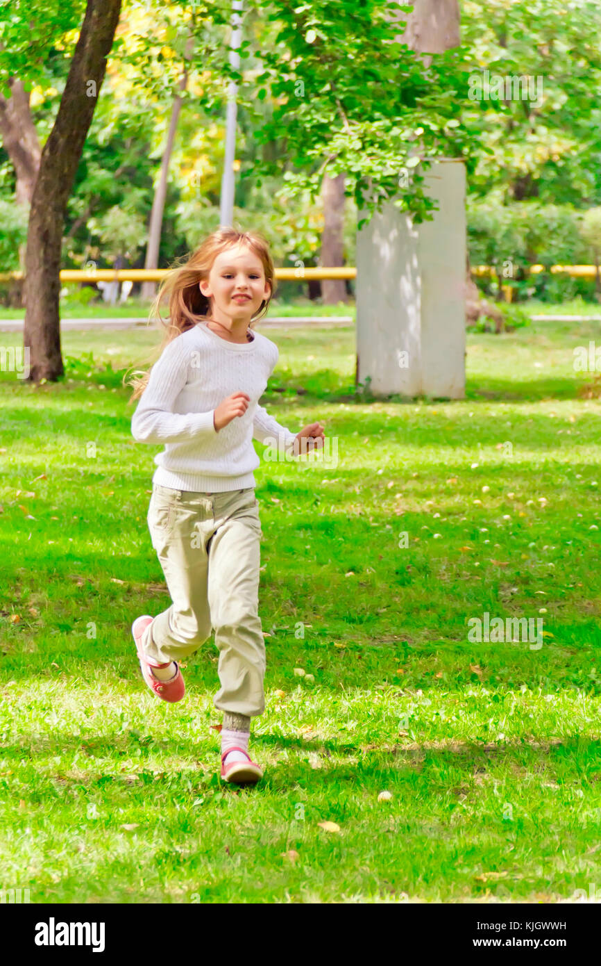 Photo of cute running girl in summer Stock Photo - Alamy