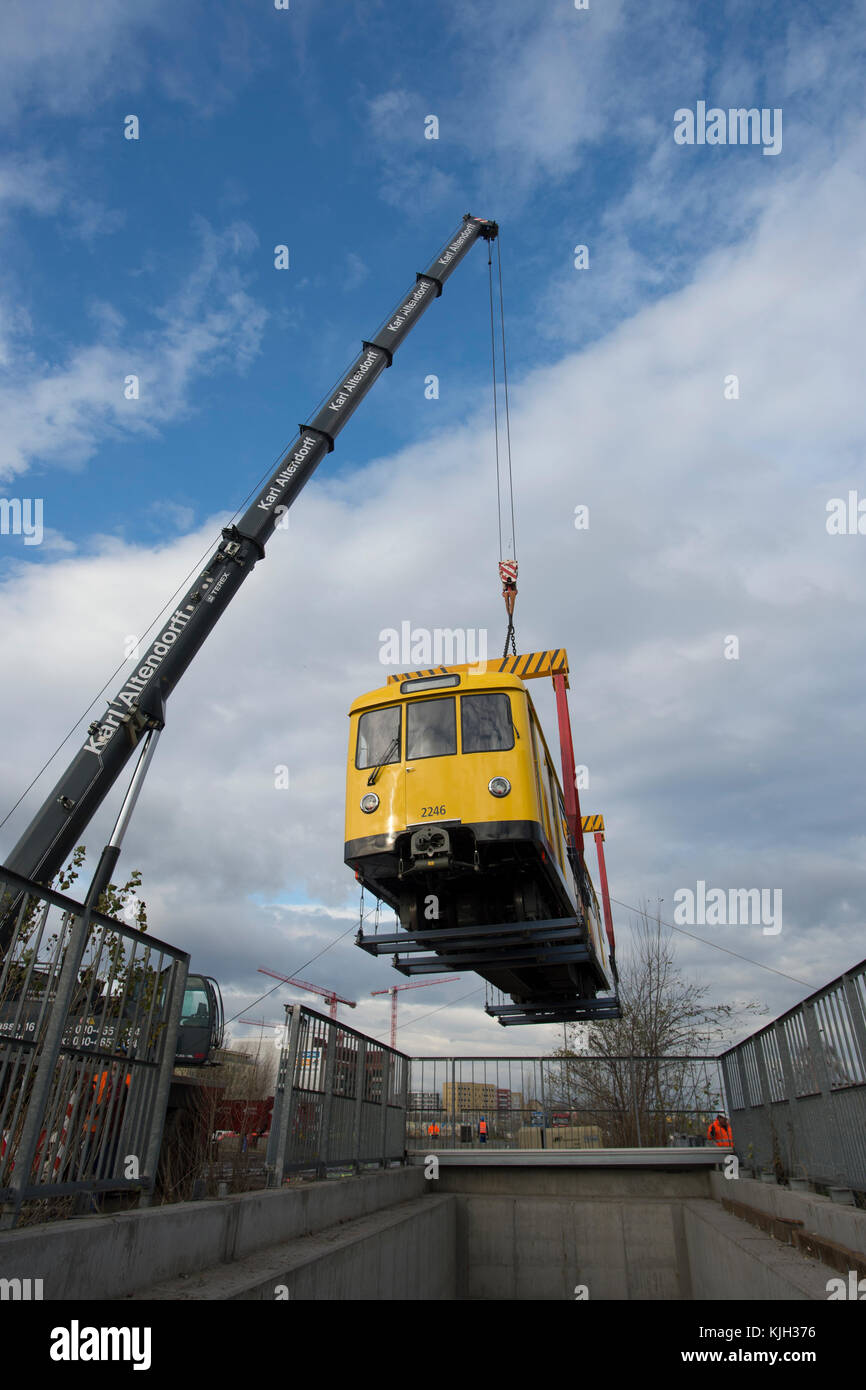 Berlin, Germany. 24th Nov, 2017. A crane lifts an underground train of ...