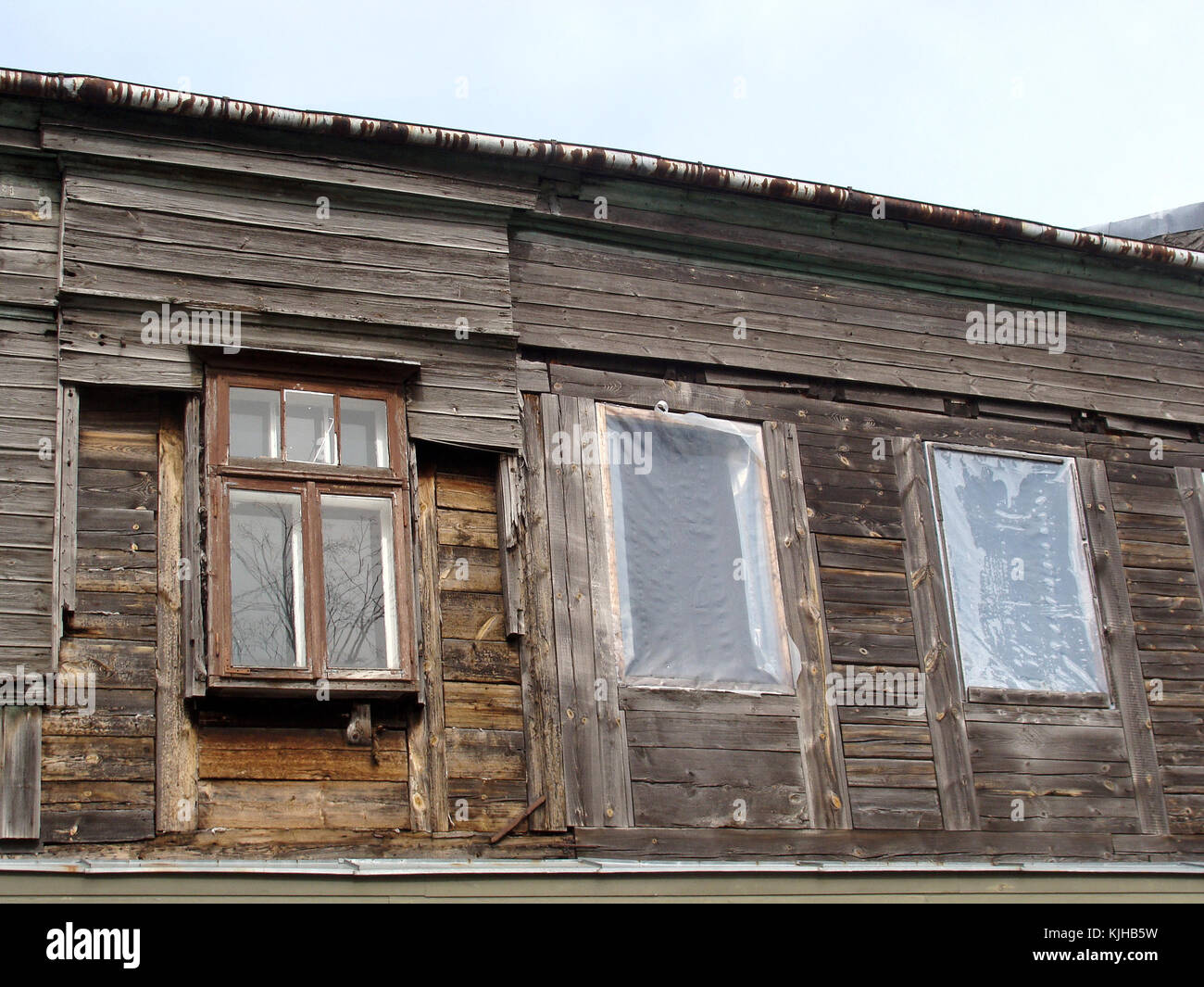 Old damaged house made from decayed rotten wooden beams Stock Photo - Alamy