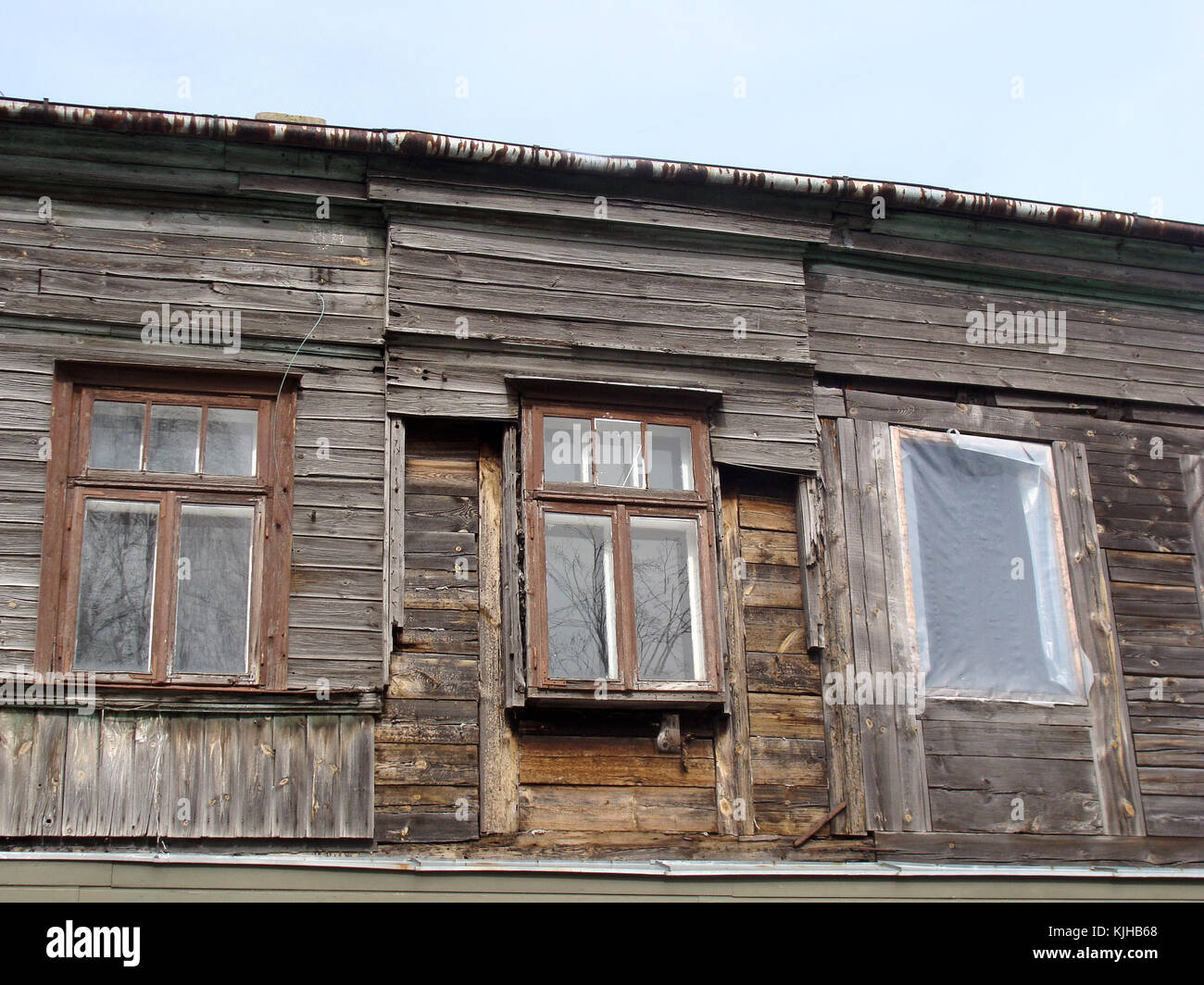 Old damaged house made from decayed rotten wooden beams Stock Photo - Alamy