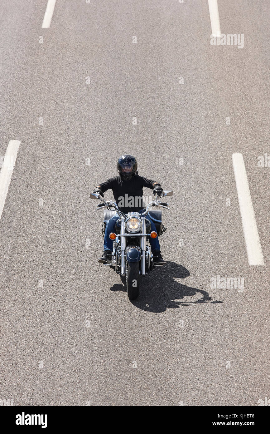 Motorcycle rider on the road. Travel and fun background. Vertical Stock ...