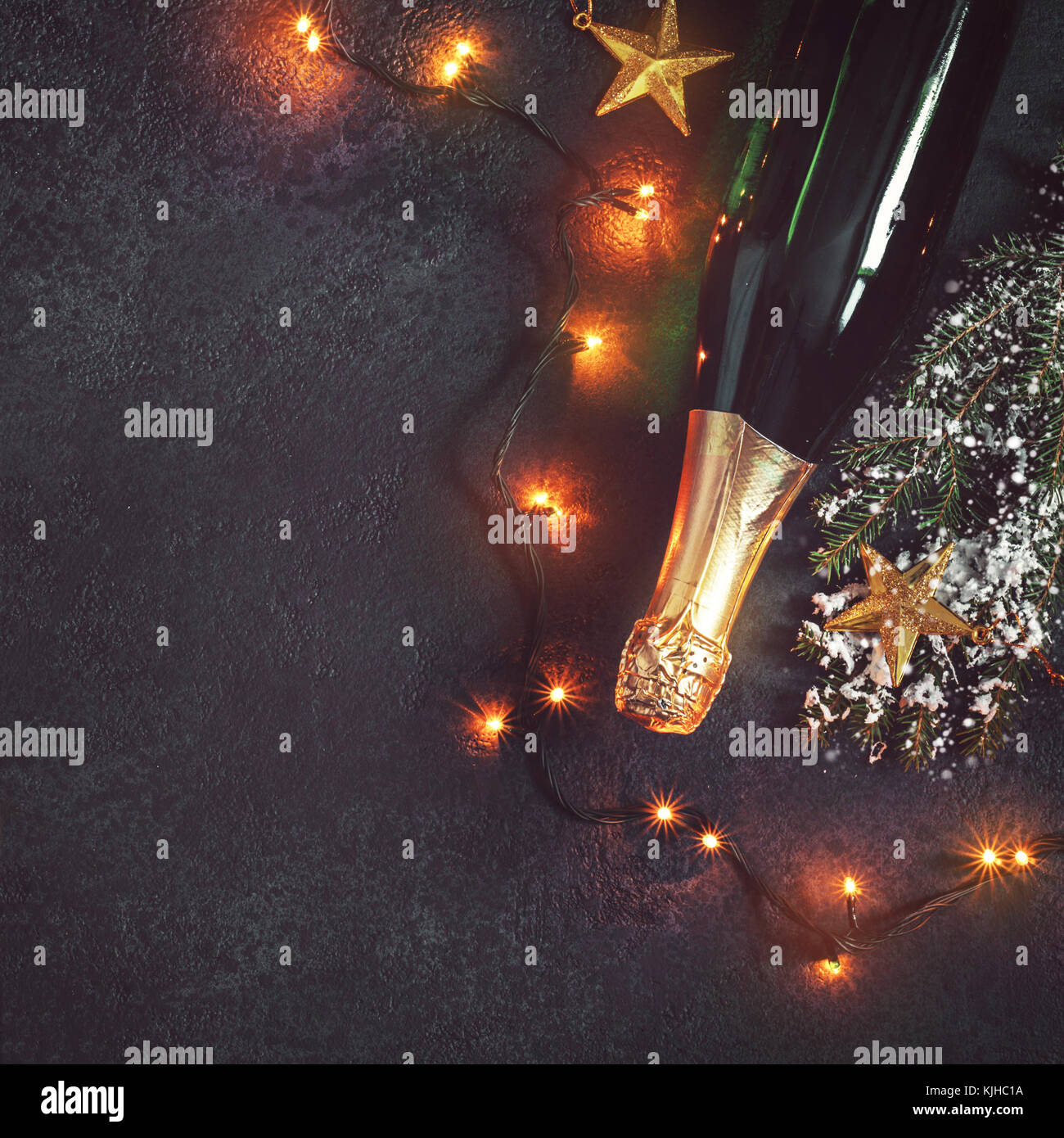 Christmas background with champagne and luminous garland Stock Photo ...