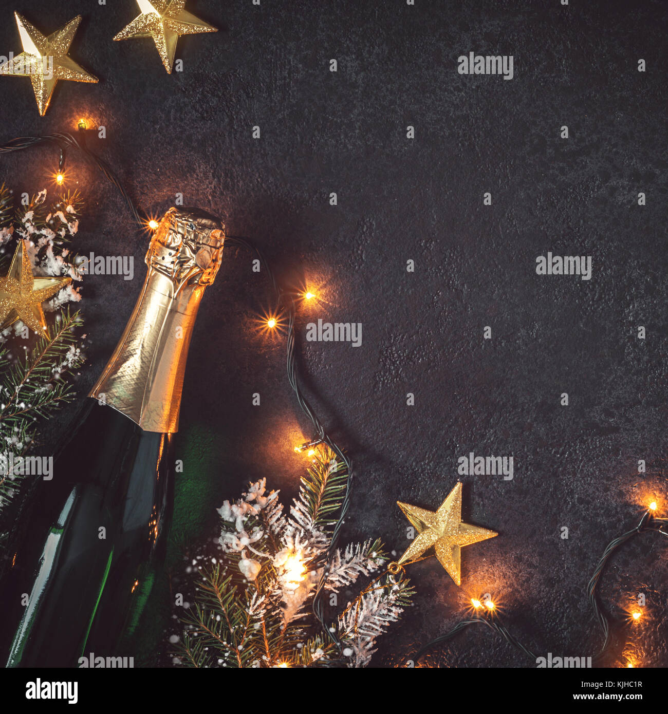 Christmas background with champagne and luminous garland Stock Photo ...