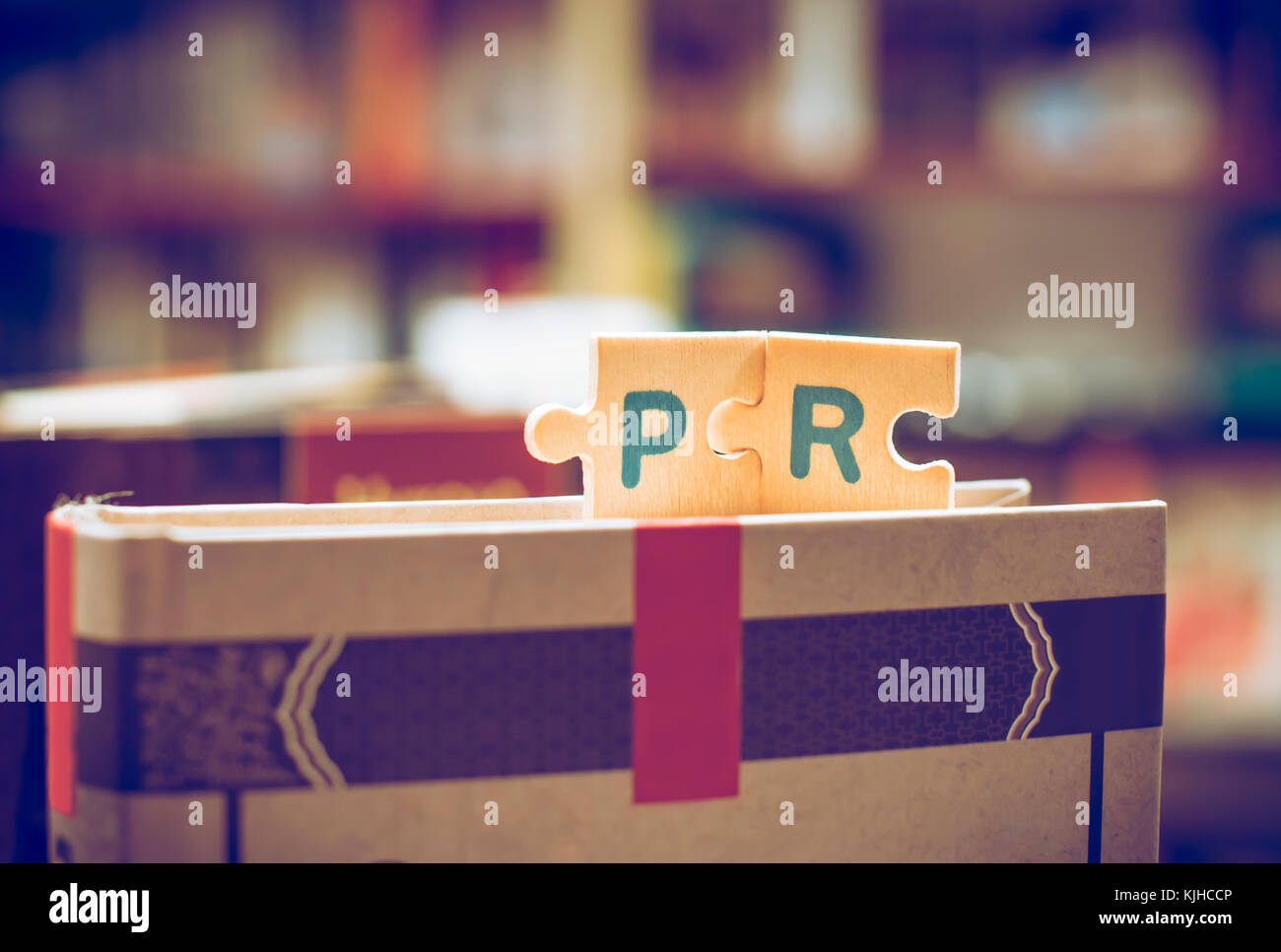 PR puzzle letters. Word PR over books in bookstore Stock Photo - Alamy