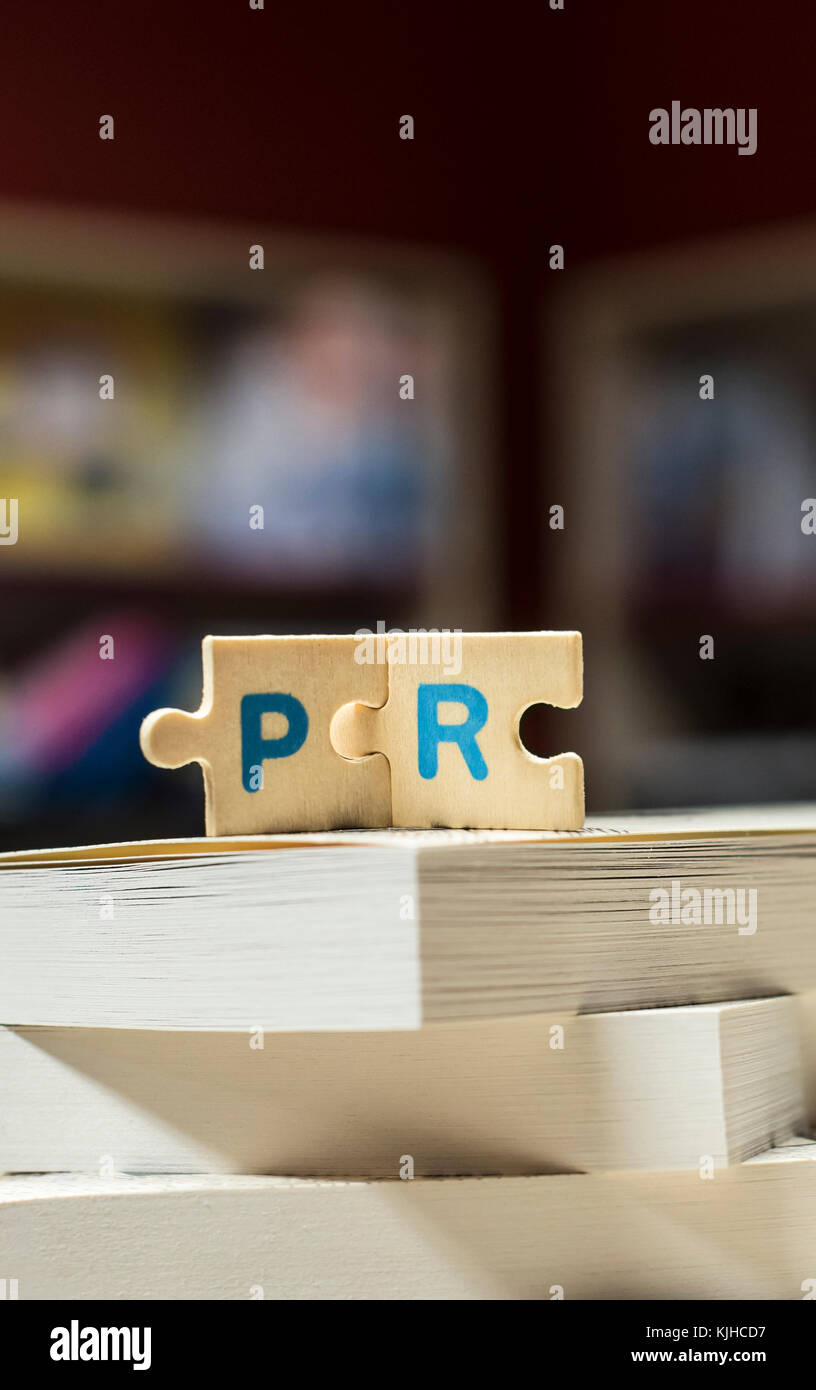 PR puzzle letters. Word PR over books in bookstore Stock Photo - Alamy