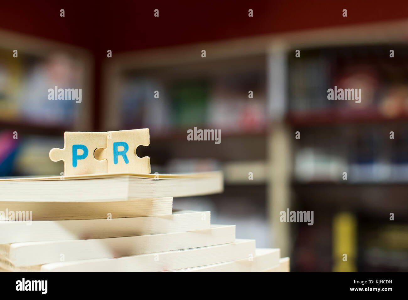 PR puzzle letters. Word PR over books in bookstore Stock Photo - Alamy