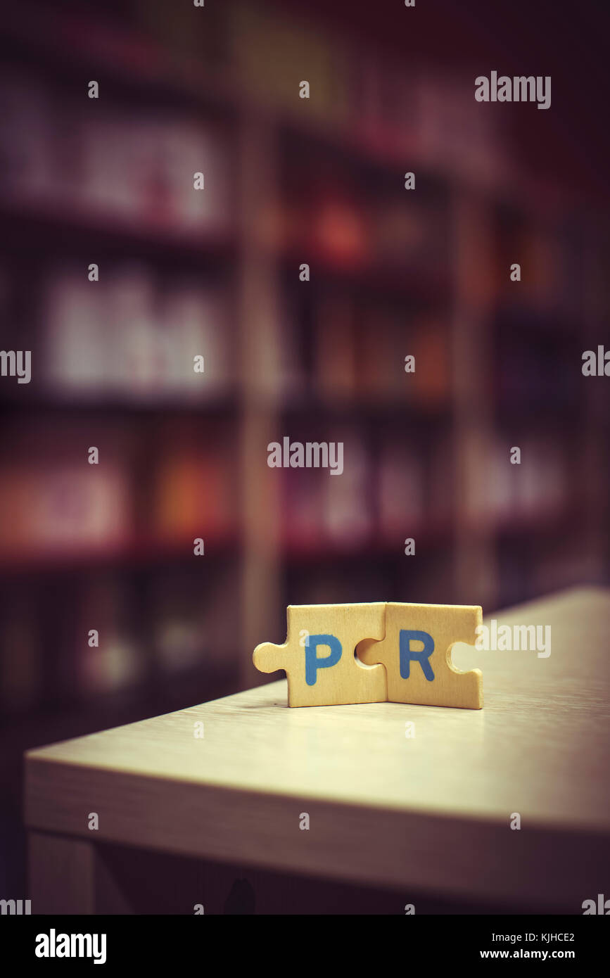 PR puzzle letters. Word PR in bookstore. Close up Stock Photo - Alamy
