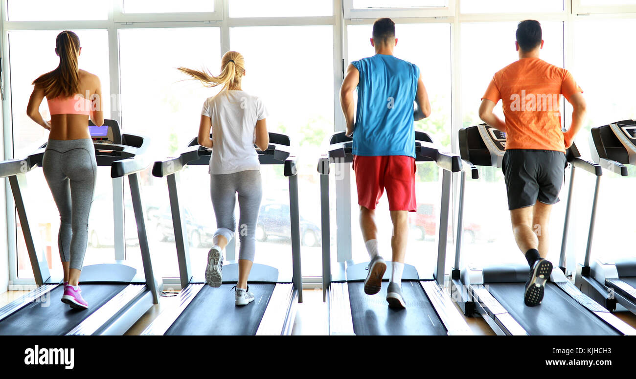 Picture of people running on treadmill in gym Stock Photo - Alamy