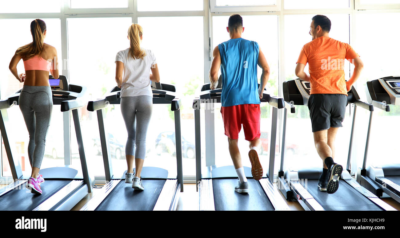 Picture of people running on treadmill in gym Stock Photo - Alamy