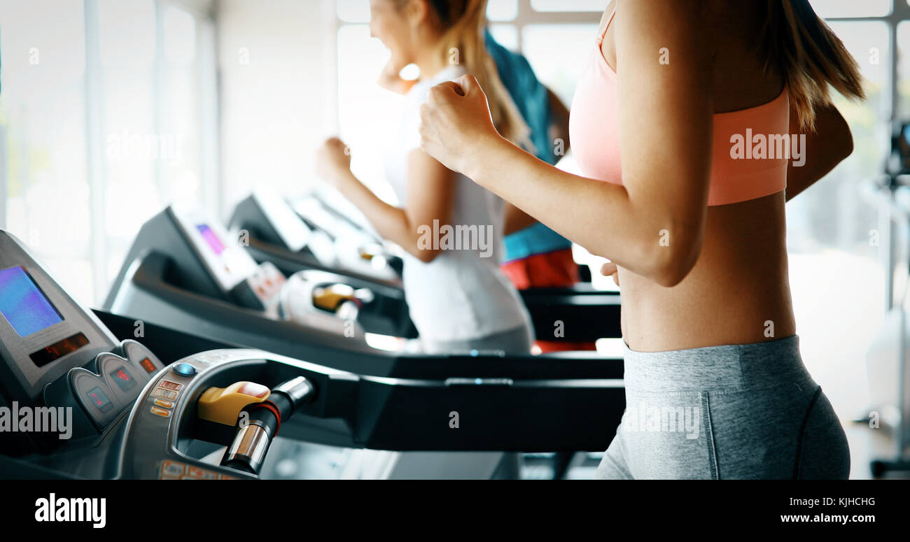 Picture of people running on treadmill in gym Stock Photo - Alamy