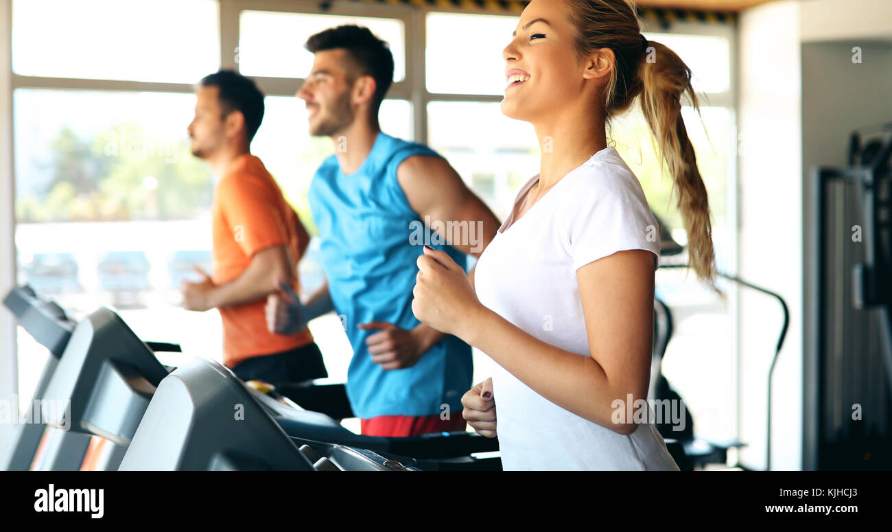 Picture of people running on treadmill in gym Stock Photo - Alamy