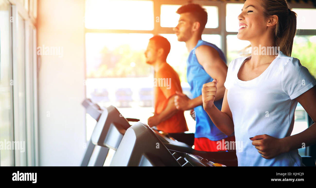 Picture of people running on treadmill in gym Stock Photo - Alamy