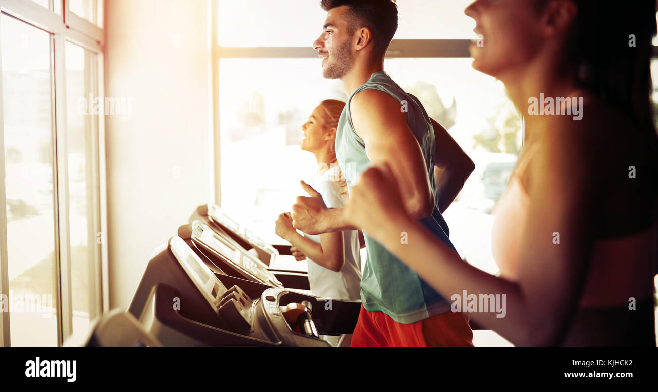 Picture of people running on treadmill in gym Stock Photo - Alamy