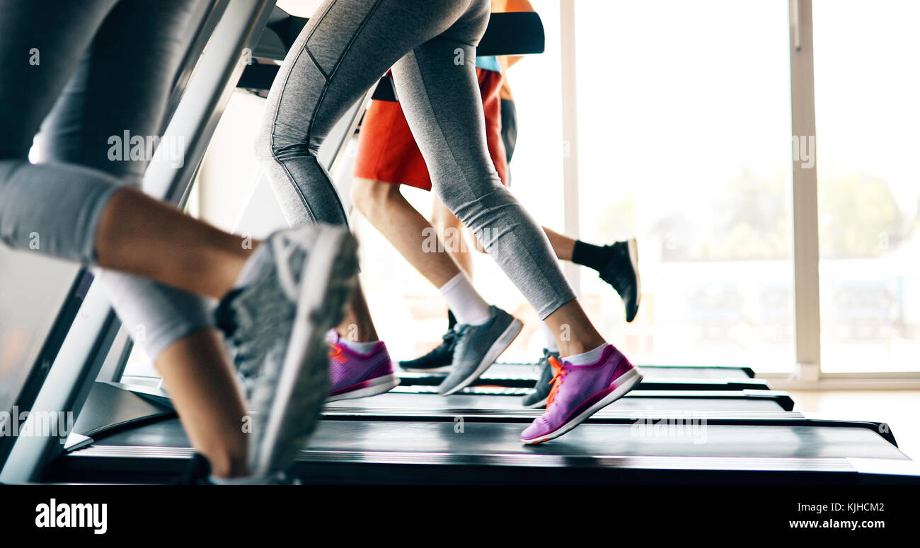 Picture of people running on treadmill in gym Stock Photo - Alamy